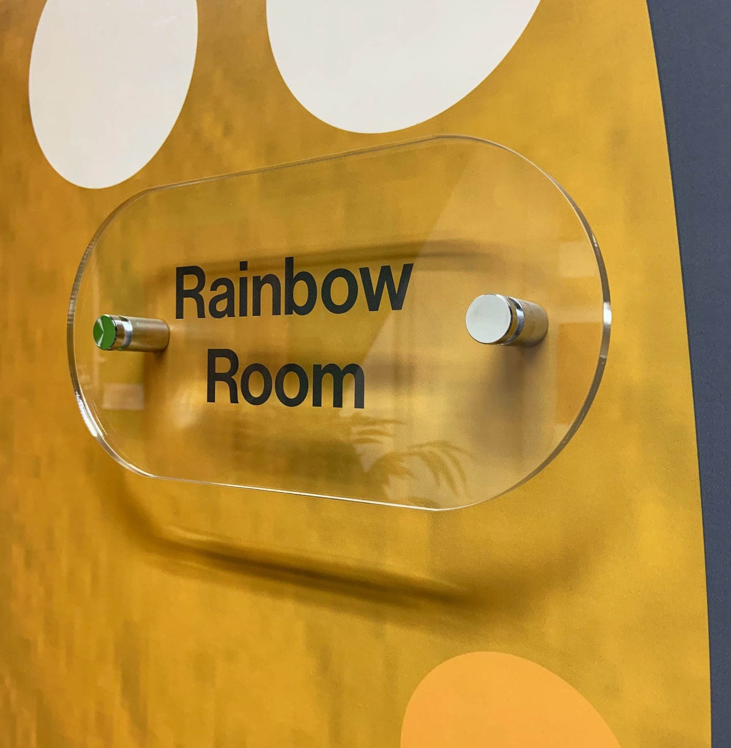 Round acrylic door sign on chrome spacers - De-Signs Harrogate